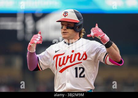 Minnesota Twins' Harrison Bader celebrates in the dugout after hitting ...