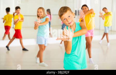 Children learn dance movements in dance class Stock Photo - Alamy