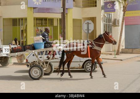 Horse carts are a popular form of transportation in Senegal, Nianing ...