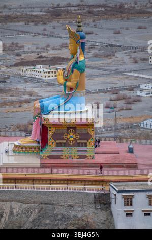 Majestic Maitreya Buddha statue at Diskit Monastery, Ladakh, with snow ...