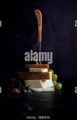 Italian aged gourmet cheeses, Parmigiano Reggiano and Gran Padano, with ...