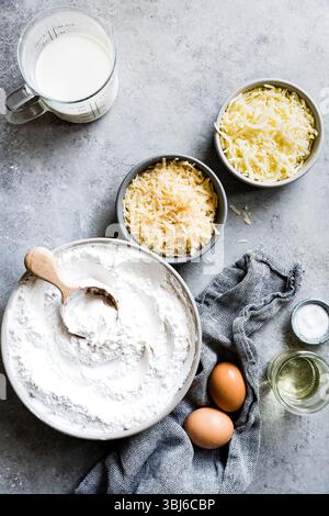 Shredded parmesan on gray wooden table Stock Photo - Alamy