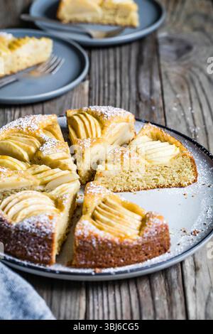 Appetizing rustic homemade cake topped with white cream and decorated ...