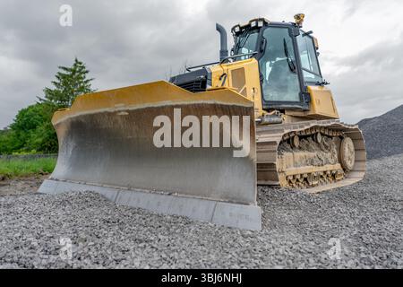 Crawler bulldozer working on construction site. Mining machinery moving ...