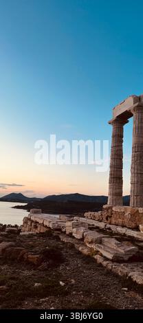 A vertical shot of the sunset above the sea. Dark beautiful background ...
