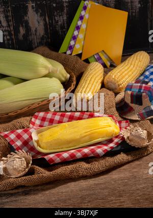 Pamonha, a traditional brazilian corn cake, served on glass plate over ...