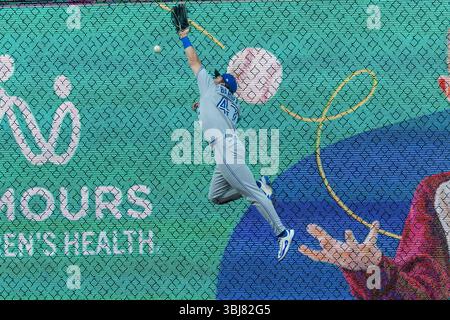 Toronto Blue Jays' Addison Barger scores on a single by George Springer ...