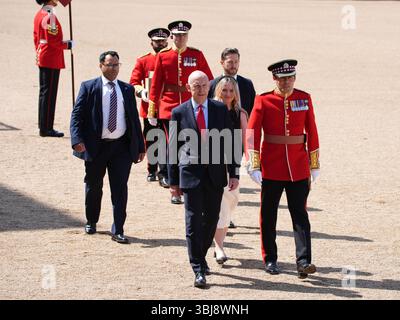 Defence Secretary John Healy (left) arrives for the Trooping the Colour ...