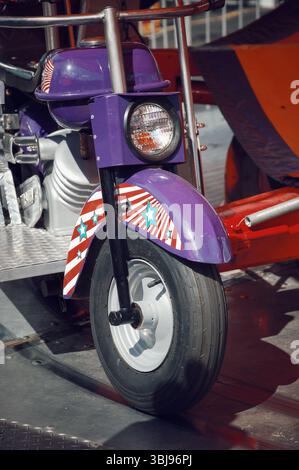 Purple kiddie motorcycle ride at the county fair Stock Photo - Alamy