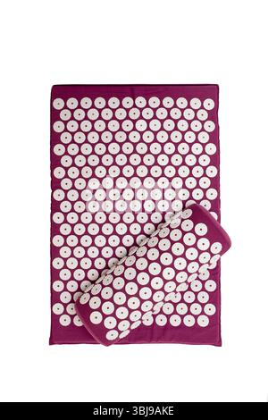 Close-up of spikes on an acupressure mat, on a white background ...