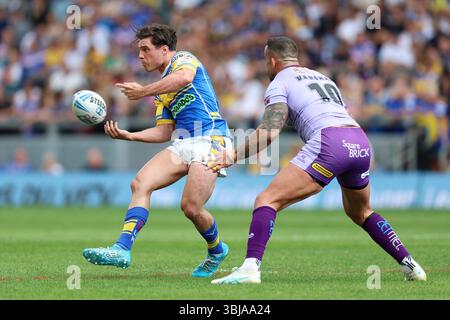 Leeds Rhinos' Brodie Croft (left) celebrates scoring a try with team ...