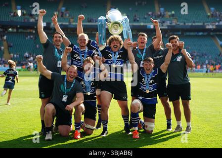 Bath Rugby's Alfie Barbeary (centre) lifts the trophy with team-mates ...