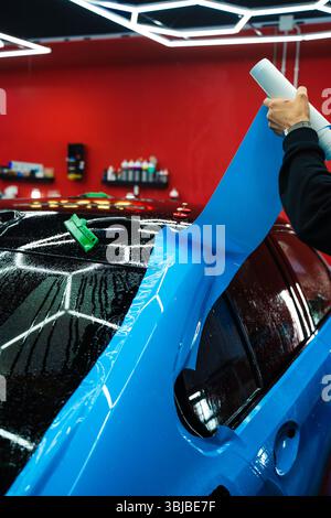 Protective film layering during PPF wrap detailing to protect the car ...