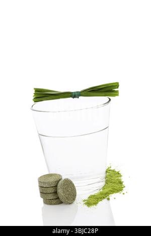 Green superfood chlorella and a glass of water. High quality photo ...