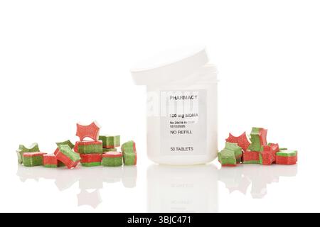 Ecstasy pills in perscription bottle isolated on white background. MDMA ...