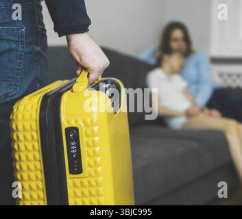 Domestic quarrel. Father with suitcase leaving his family Stock Photo ...