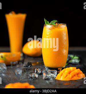Iced mango glass, refreshing summer juice Stock Photo - Alamy