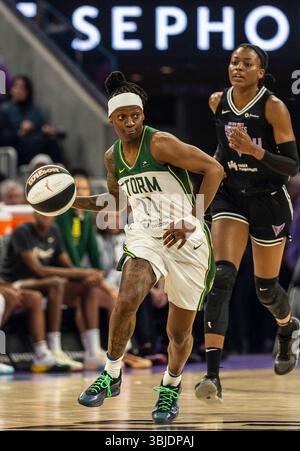 Seattle Storm guard Erica Wheeler, left, runs for the loose ball ...