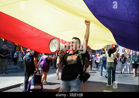 Protesters carry a banner and republican flags during a march against ...