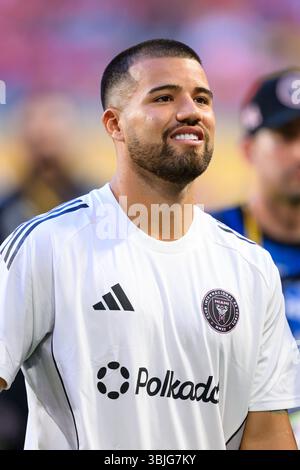 Inter Miami defender Marcelo Weigandt (57) lifts forward Lionel Messi ...