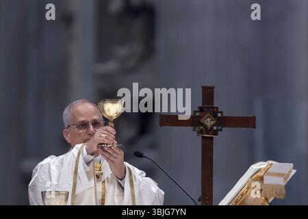 Pope Leo XIV raises a chalice during the Christmas Eve Mass at St ...