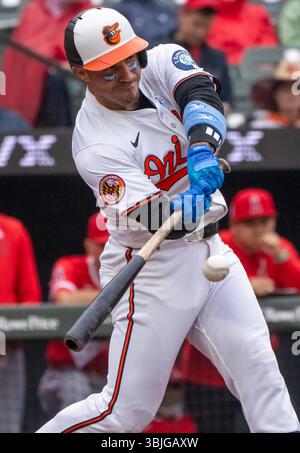 Baltimore Orioles' Ramón Laureano (12) hits an RBI double in the 10th inning of a baseball game ...