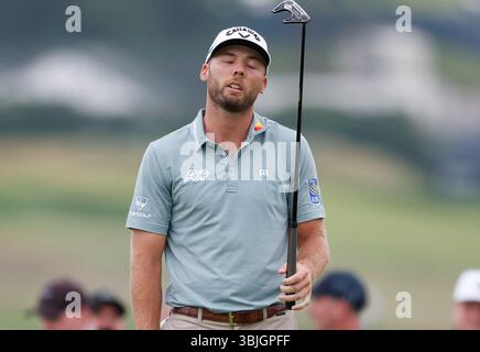 Sam Burns reacts after missing a putt on the second hole during the ...
