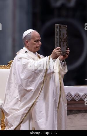 Pope Leo XIV holds the Gospel during a Prayer Vigil on the occasion of ...