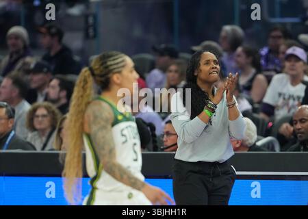 Seattle Storm head coach Noelle Quinn, center, watches as her team ...