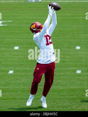 Washington Commanders wide receiver Chris Moore (19) takes down Las ...