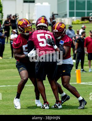 Washington Commanders defensive end Jacob Martin (55) rushes during an ...
