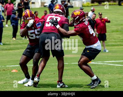 Washington Commanders defensive end Jacob Martin (55) rushes during an ...