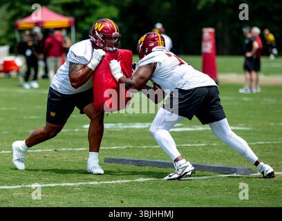 Washington Commanders offensive tackle Trent Scott (73) stands on the ...