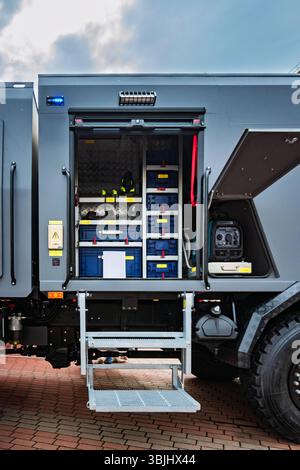 Armored demining vehicle with open equipment compartment, showcasing ...