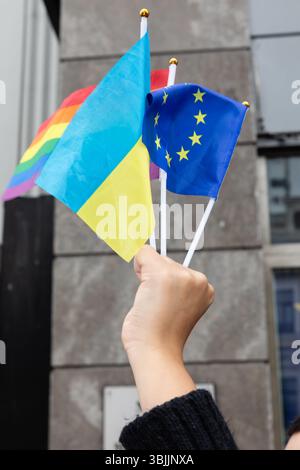 June 14, 2025, Kyiv, Ukraine: A young boy holds a flag amidst the ...