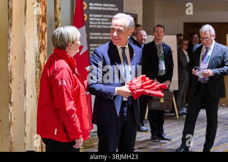 Prime Minister Mark Carney, right, is seen with Northwest Territories ...