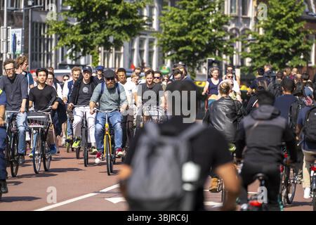 Central cycle path along the Vredenburg, in the city centre of Utrecht ...
