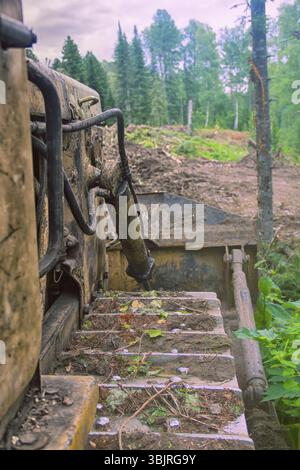 Destruction of forests for construction. Bulldozer clears site for ...