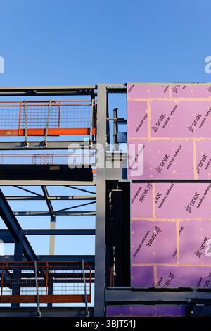 Steel skeleton frame with weather defence backing boards attached ...