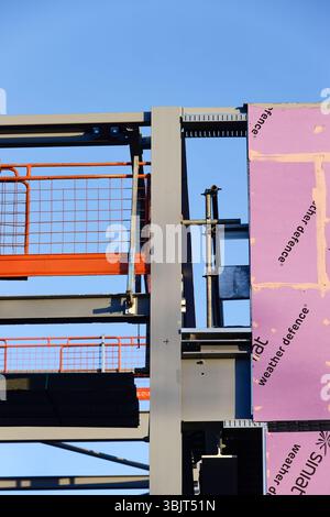 Steel skeleton frame with weather defence backing boards attached at ...