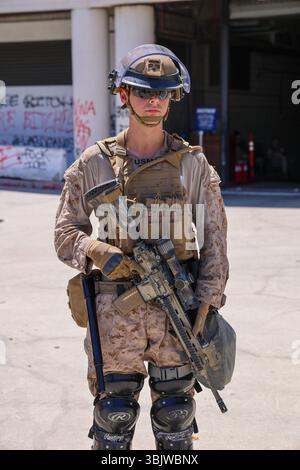 U.S. Marines guard the Edward R. Roybal Federal Building on Monday ...