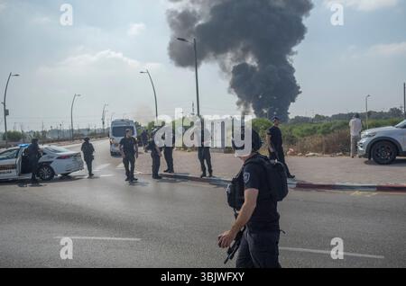 Herzliya, Israel. 17th June, 2025. Heavy smoke billows from a site hit ...