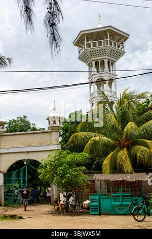 A man rides a bicycle in front of a building ruined by shelling in Borodyanka, Ukraine, Tuesday ...