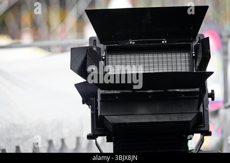 Industrial reflector against blurry background Stock Photo - Alamy