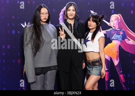 EJAE, Rei Ami, and Audrey Nuna of HUNTR/X onstage during the 2025 MTV ...