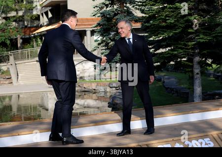 Prime Minister Mark Carney shakes hands with Alberta Premier Danielle ...