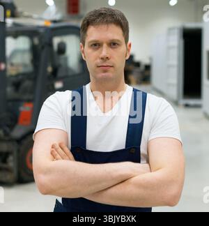 Handsome forklift operator in the warehouse Stock Photo - Alamy