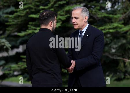Prime Minister Mark Carney shakes hands with Joel Lightbound, Minister ...