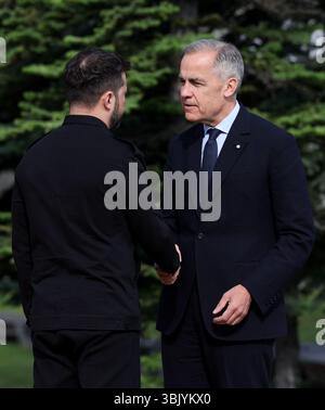 Prime Minister Mark Carney shakes hands with Joel Lightbound, Minister ...