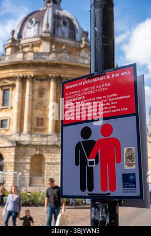 Sign warning of the danger of pickpockets in several languages ...